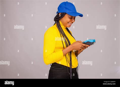 An African Female Model Typing On A Terminal In Isolated White