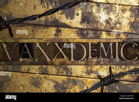 vaxxdemic text formed with real authentic typeset letters on vintage