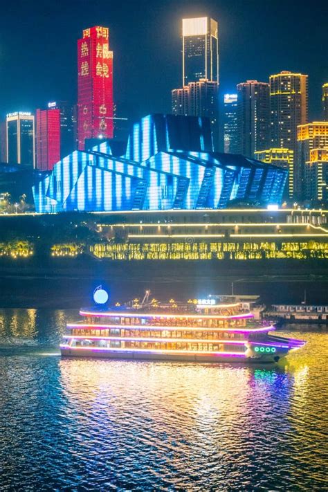 Beautiful Night View Of A Colorful Cruise Ship Traveling On River