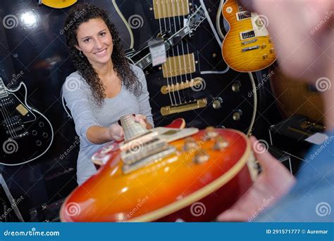 Lady Passing Guitar Forward Stock Image Image Of Shop Rock 291571777