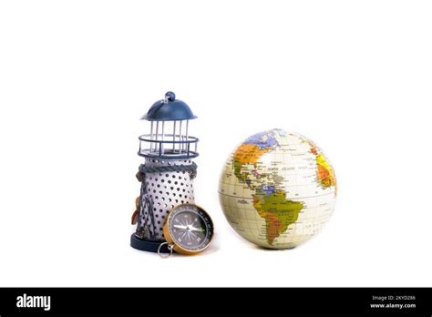 Lighthouse Globe And Compass Side By Side On A White Background Stock