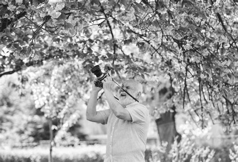Hobby And Leisure Experienced Photographer In Spring Garden