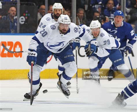 Nicholas Paul Of The Tampa Bay Lightning Grabs A Puck Against The