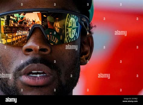 Seattle Mariners Second Baseman Ryan Bliss Walks In The Dugout Before A
