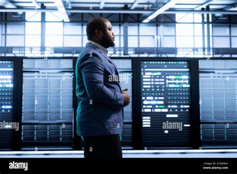 Engineer Walking In Data Center Monitoring System Performance