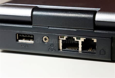 Closeup Of The Usb Ethernet And Modem Ports On The Back Of A Laptop