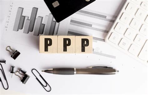 Ppp Abbreviation On Wooden Blocks With Financial Charts Credit Card