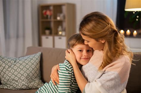 Premium Photo Happy Smiling Mother And Son Hugging At Home