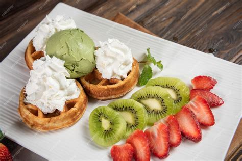 Free Photo Waffle With Ice Cream Whipped Cream And Fruits