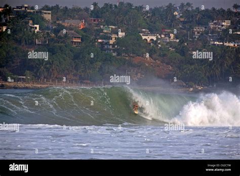 Surfing At The Mexican Pipeline On Zicatela Beach Puerto Escondido