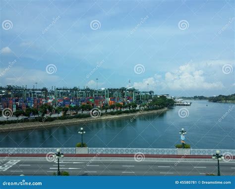 heavy containers loading with the peaceful sea side view editorial