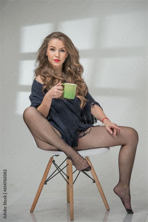 Attractive Woman In Black Pantyhose And Long Legs Posing Challenging