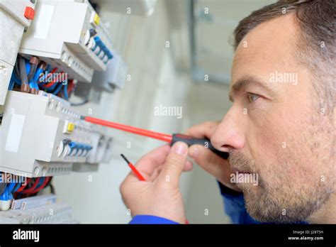 Man Wiring Fuse Into Box Stock Photo Alamy