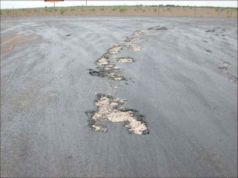 3 Pavement Damage Picking Up Of Seal Coat Caused By Bleeding