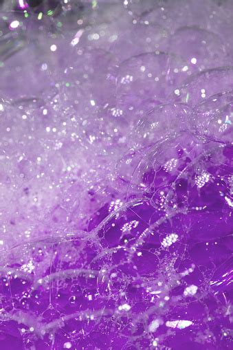 Close Up Of Bath Water Bubbles Foam For Background In Purple Stock