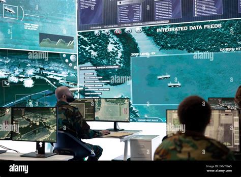 Army Personnel Monitoring Surveillance Imagery From Satellite System On