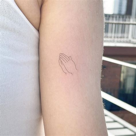 Minimalistic Praying Hands Tattoo Located On The