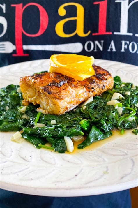 One Of Sevillas Best Dishes Orange Cod With Sautéed Spinach