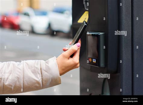 Payment For Parking Using Contactless NFC Technology Supported Visa And Mastercard Closeup