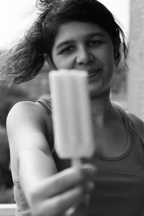 A Woman Holding A Popsicle Stick Stock Image Image Of Face Adult 393954035