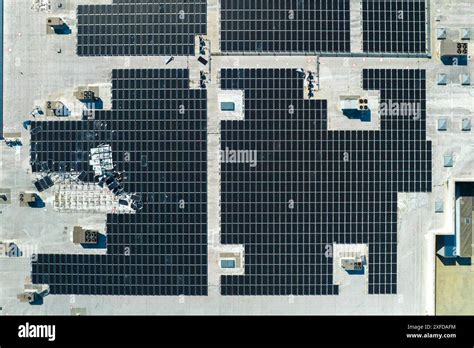 Destroyed By Hurricane Winds Broken Down Photovoltaic Solar Panels Mounted On Industrial