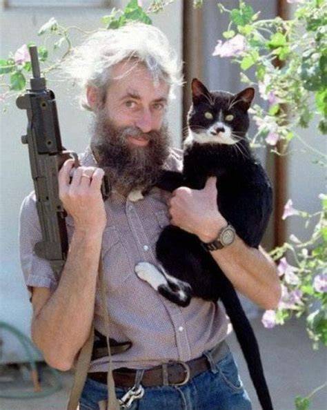 Oh You Know Just A Bearded Man Holding An Uzi And A Cat Rpics