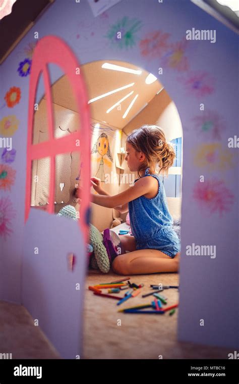 Charming Girl Playing In Toy House Stock Photo Alamy