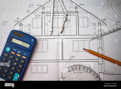 Workplace Of Architect Designing Blueprint Of Building Using Calculator Compass Protractor