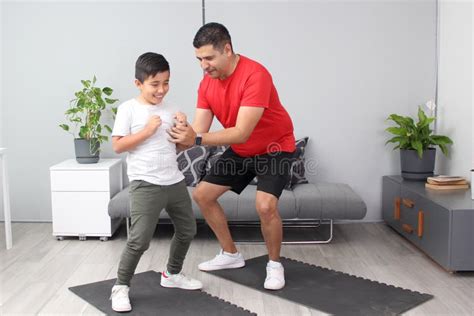 Boxing Classes In The Living Room Between Dad And Son As A Student