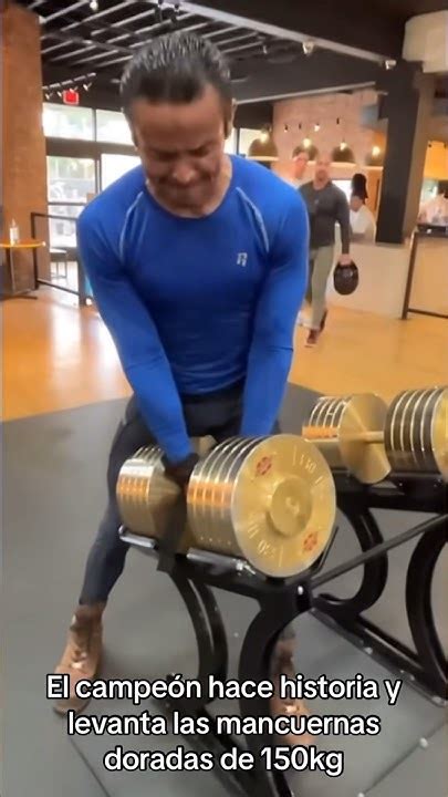 El Campeón Levanta Las Mancuernas De Oro Mancuernas Golden Dumbell
