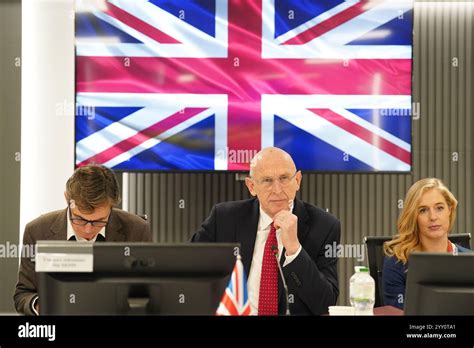 Defence Secretary John Healey Centre Listens During A Meeting With