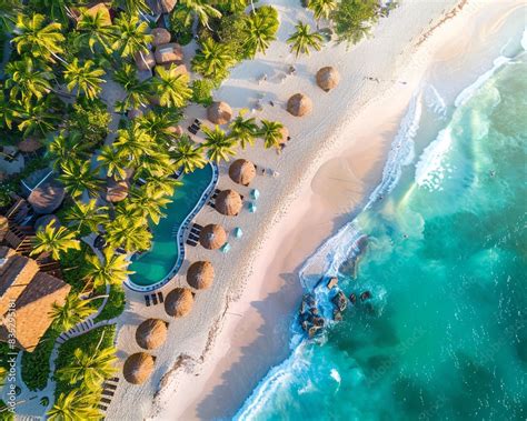 Luxurious Beach Resort View From Above With Infinity Pools And Palm