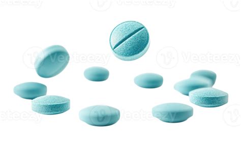 Blue Tablets Fall Gracefully On A White Surface Creating A Striking