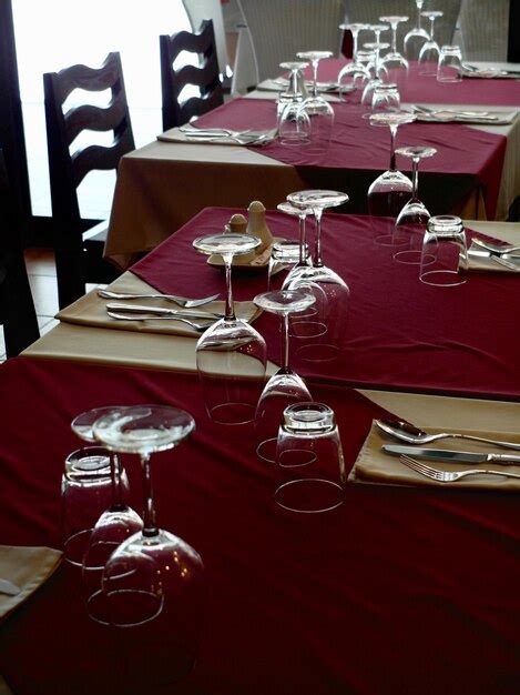 Premium Photo Upside Down Glasses On Table At Restaurant
