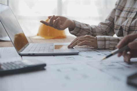 Two Business Man Construction Site Engineer Engineering Objects On Workplace With Partners