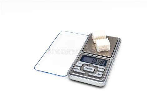 A Sugar Cube Lies On A Small Scale Stock Image Image Of Control