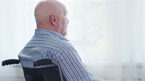 Old Man Patient In A Nursing Home Assistance Rehabilitation And