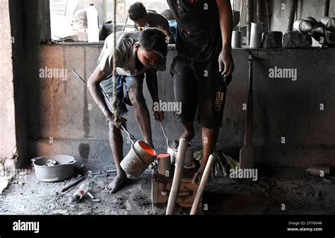 Ambatolampy Artisanal Aluminium Foundery Worker With Crucible With Cast Aluminium Central