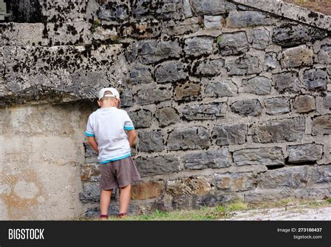 Boy Pissing On Stone Image And Photo Free Trial Bigstock