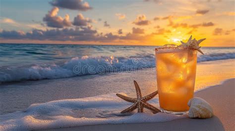 Refreshing Cocktail Placed On Sandy Beach During Sunset Stock