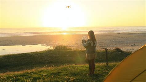 Woman Pilot Drone At Beach Sunset And Quadcopter Flight In Air Spy Or