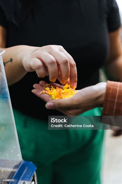 Showing Off Recycled Plastic Bottle Caps Turned Into Plastic Shreds