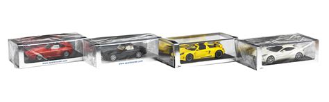 Bonhams Cars Four Boxed 1 43 Scale Die Cast Models Of Sports Cars By