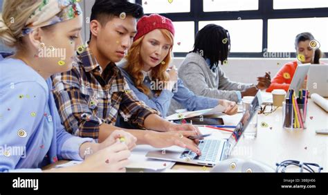 Collaborating Group Of Classmates Studying In Modern Study Room With