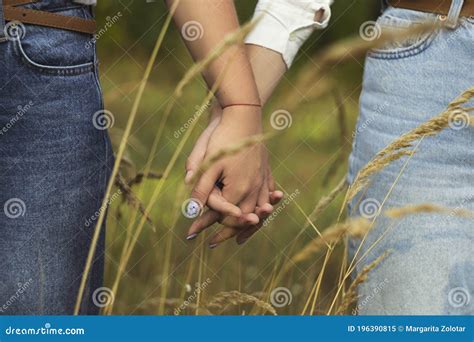 Same Sex Love Of Girls Girls Hold Hands During Quarantine Stock Image