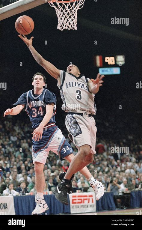 Georgetowns Allen Iverson 3 Puts The Ball Up After Being Fouled By Villanovas Eric Eberz 34