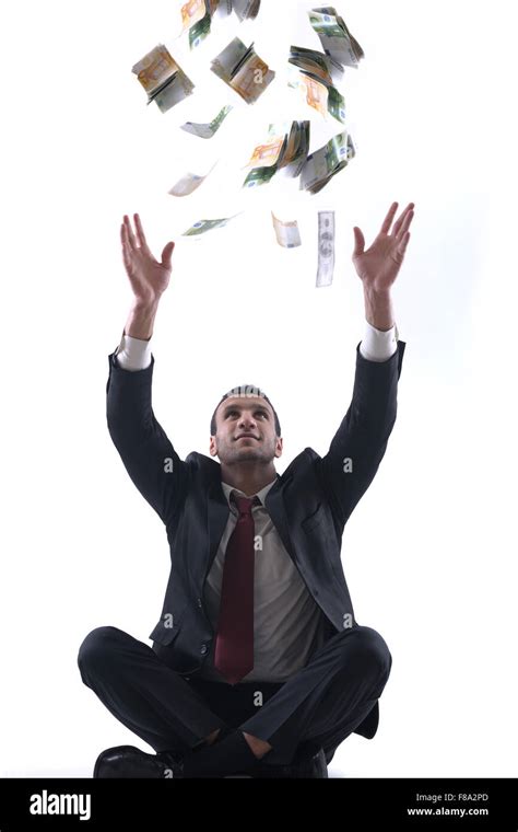 Portrait Of A Business Man Holding And Catch Falling Money Bills