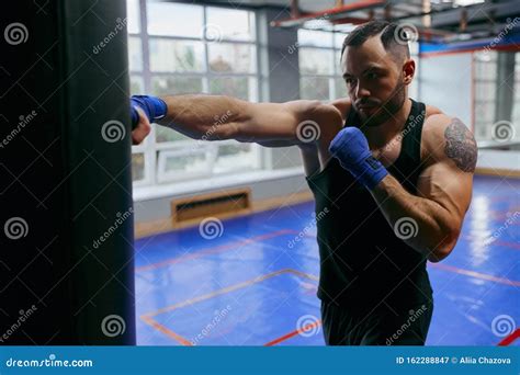 Young Man Stricking Punching Boxing Bag Stock Image Image Of