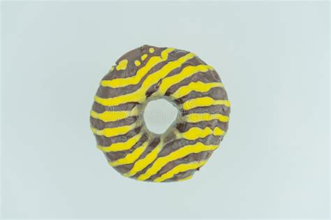 A Colorful Doughnut With A Zebra Patterned Frosting Yellow And Brown On