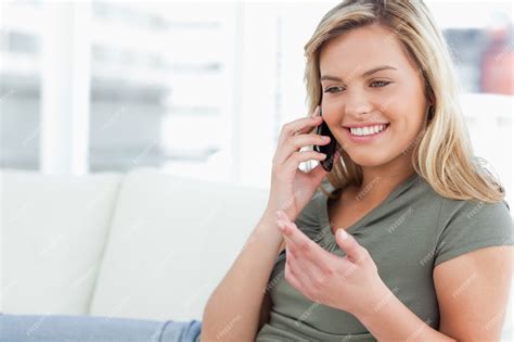 Woman With Raised Hand Making A Call And Smiling Premium Photo